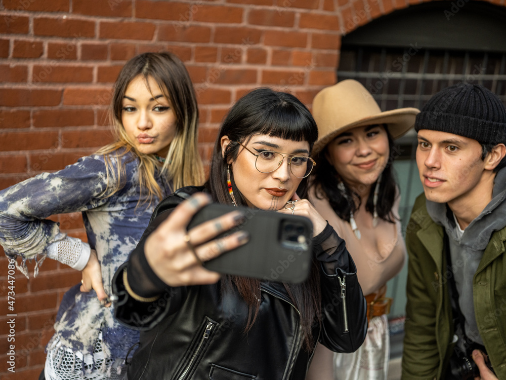 Young Indigenous friends making a selfie outdoors Stock Photo | Adobe Stock