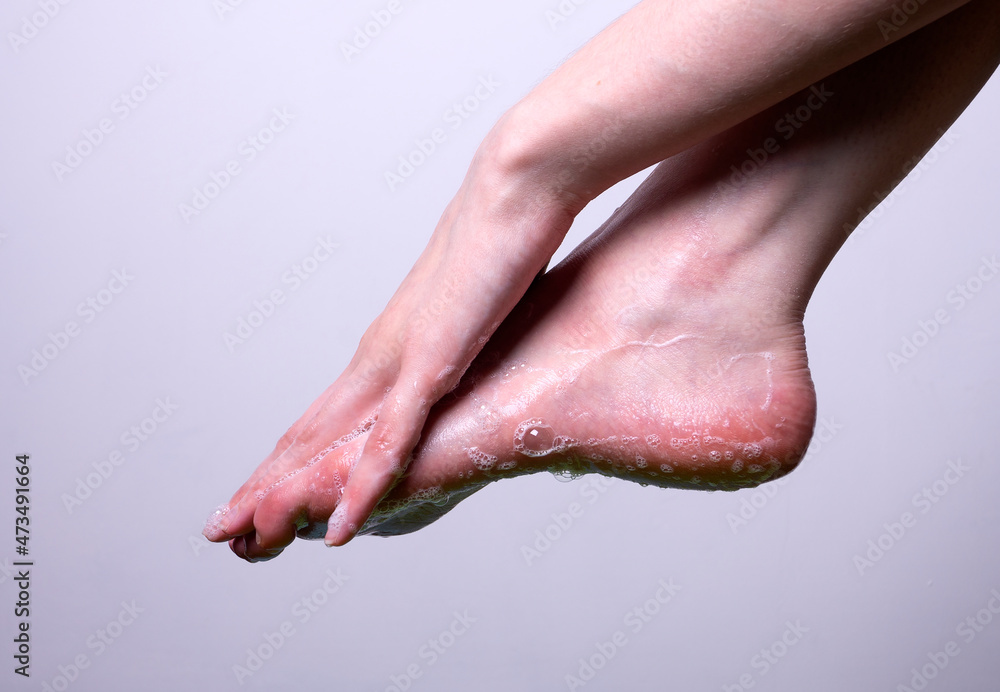 Washing your feet. Foam feet. Wash your feet with soap Stock Photo ...
