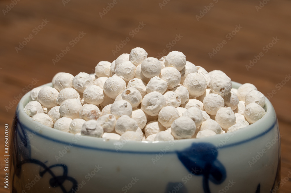 Gorgon fruit in a bowl or plate on a wood grain table Stock Photo ...