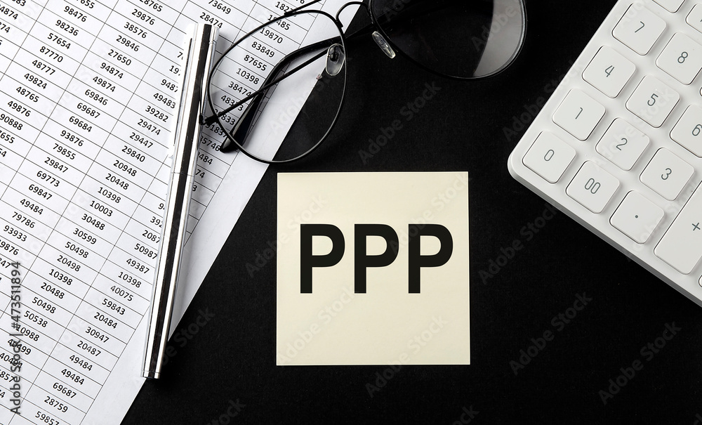 Concept PPP message on sticker with glasses,chart and calculator on the ...