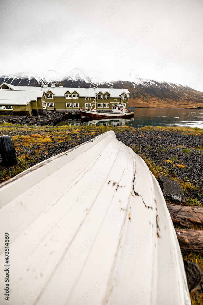 rowing boat laying upside down in Siglufjörður Harbour view to the Ship ...