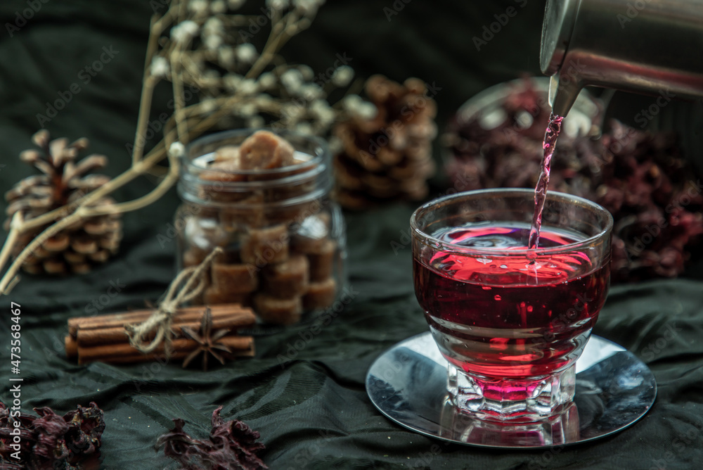 Roselle tea (Jamaica sorrel, Rozelle or hibiscus sabdariffa ) is poured ...