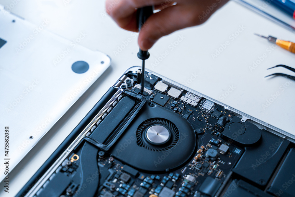 Computer repair man. Pc technician service with laptop on hardware ...