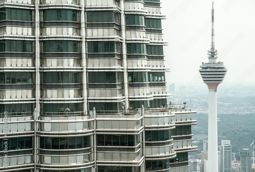 Facade of the iconic Petronas Towers, with Menara KL communications ...