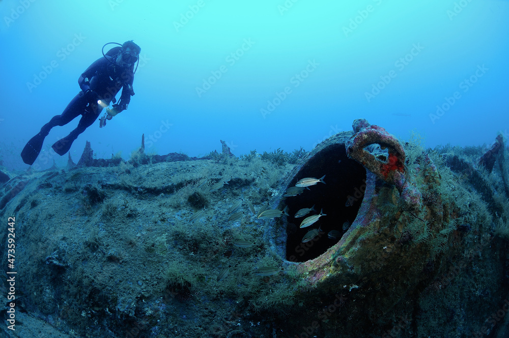 Scuba diver looks into escape hatch of German U-Boat U-352, North ...
