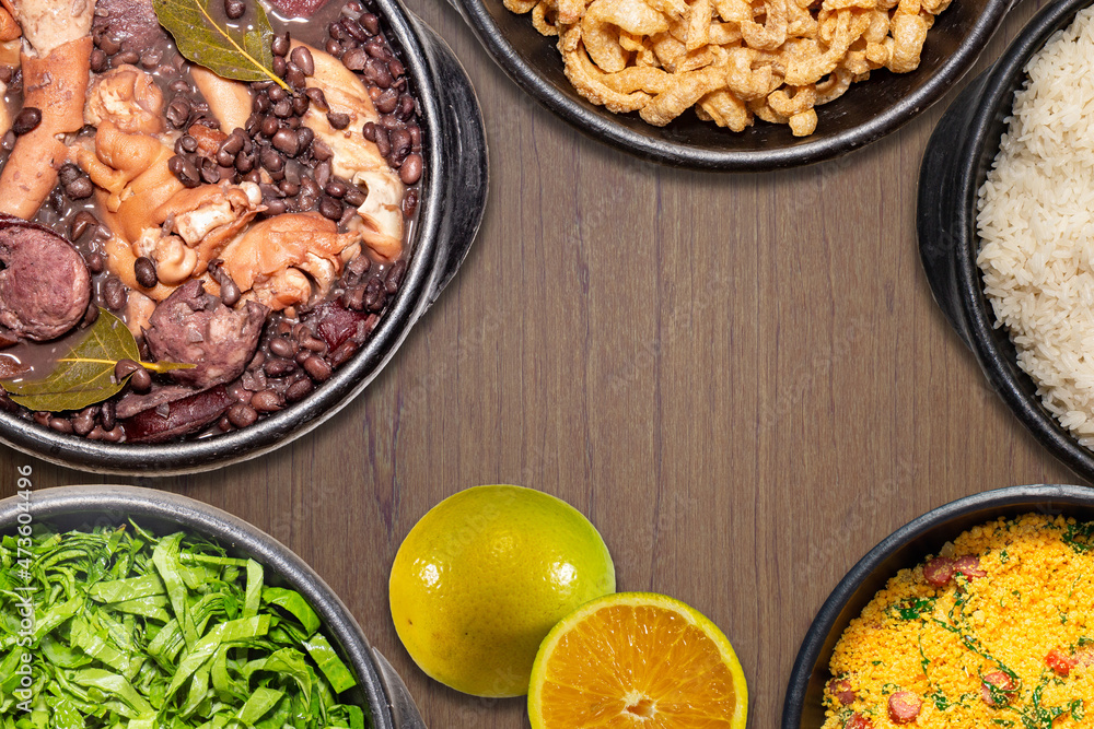 Typical Brazilian feijoada food in top view with the typical ...