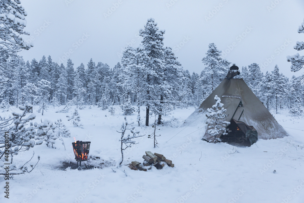 Camping teepee tent and firepit. Winter scene in Swedish Lapland Stock ...