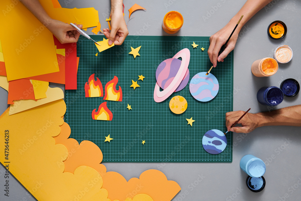 Multi-colored papercrafts on the cutting mat Stock Photo | Adobe Stock