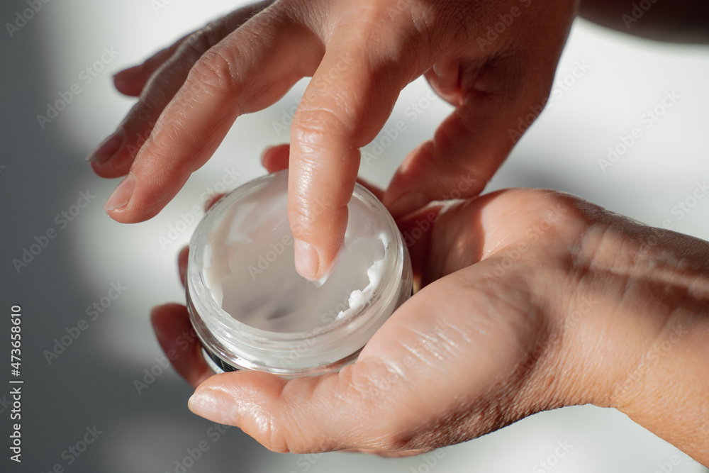 Using Skin Cream Stock Photo | Adobe Stock