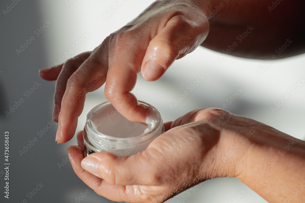 Using Skin Cream Stock Photo | Adobe Stock