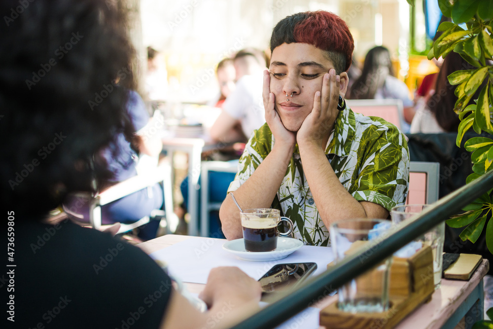 Gen Z latino trans man spending time with his mother Stock Photo ...