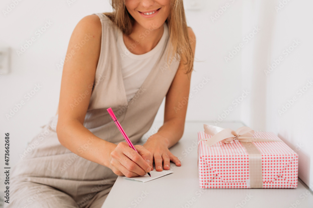 Woman Writing Gift Card Stock Photo | Adobe Stock