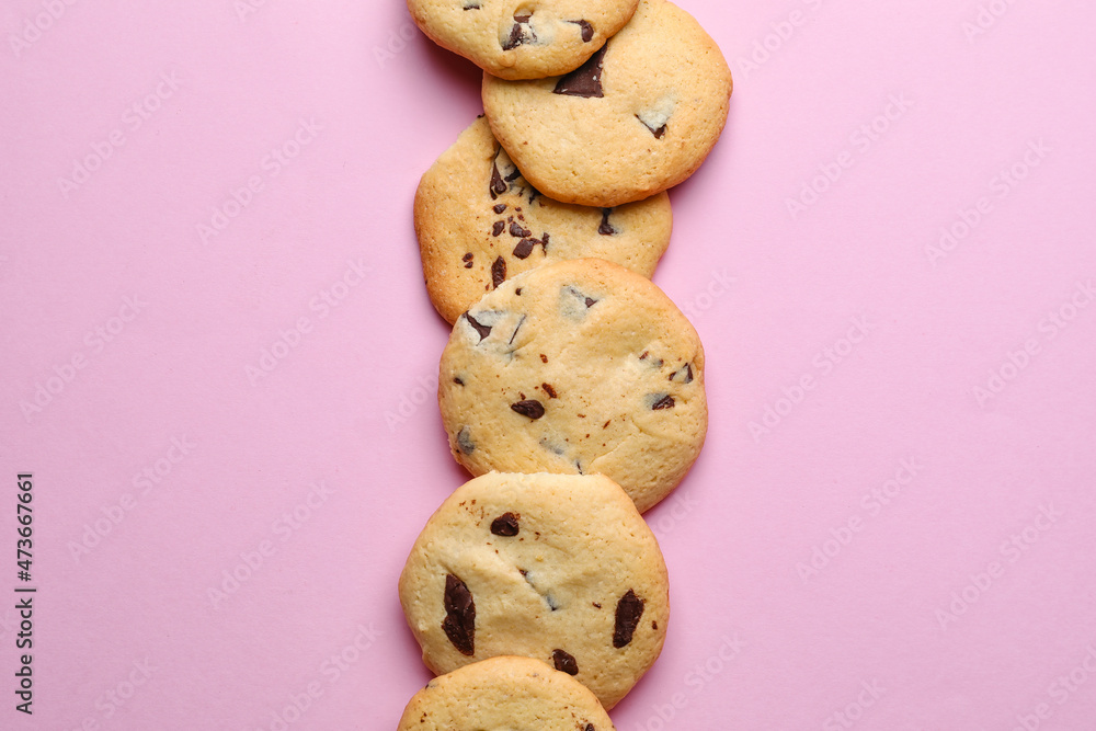 Tasty cookies with chocolate chips on pink background Stock Photo ...