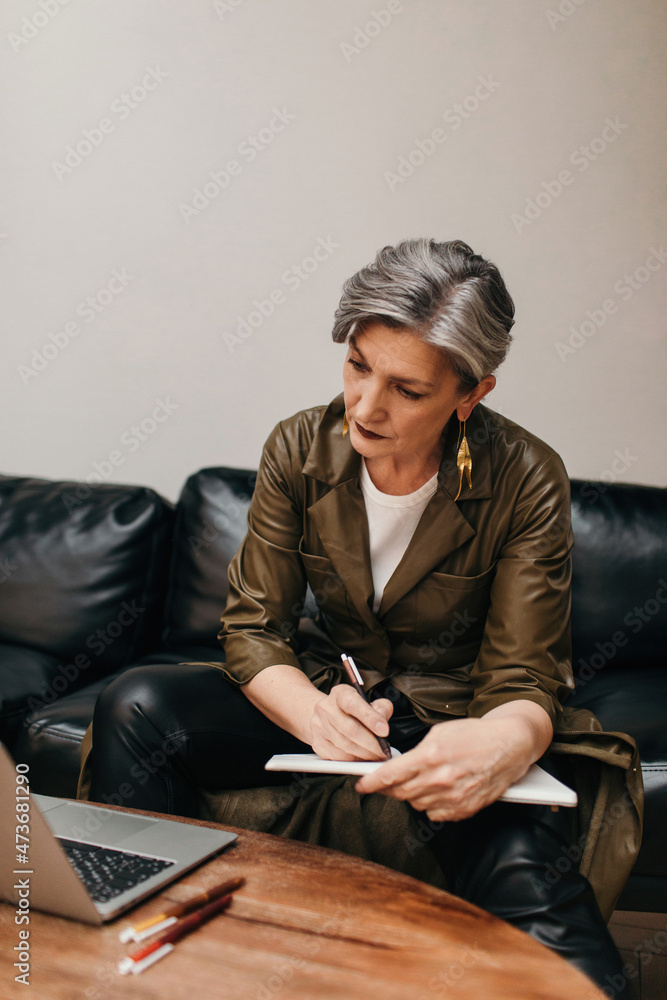Mature woman studying at home - Online lesson from home Stock Photo ...