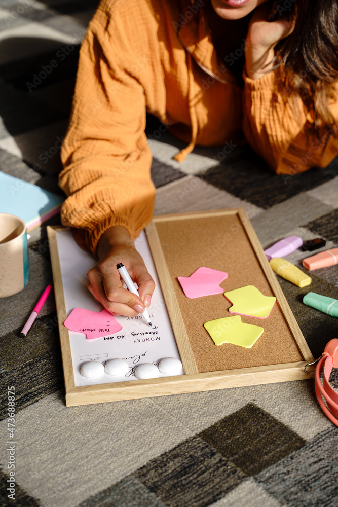Female planning weekly schedule Stock Photo | Adobe Stock