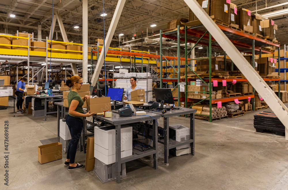 Warehouse workers at shipping station at cargo center Stock Photo ...
