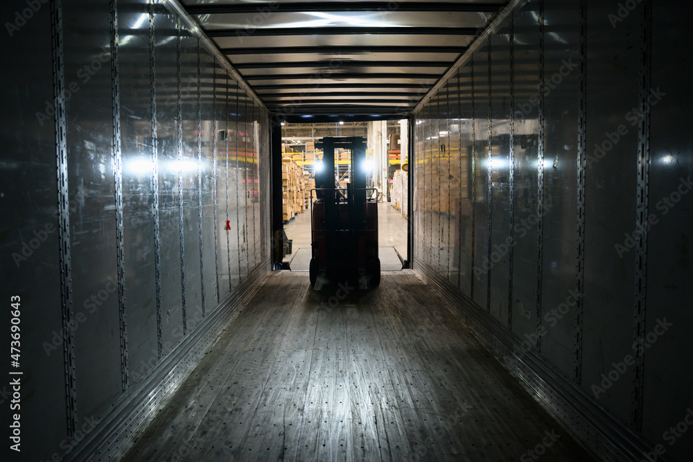 Forklift Loading Semi truck at warehouse Stock Photo | Adobe Stock