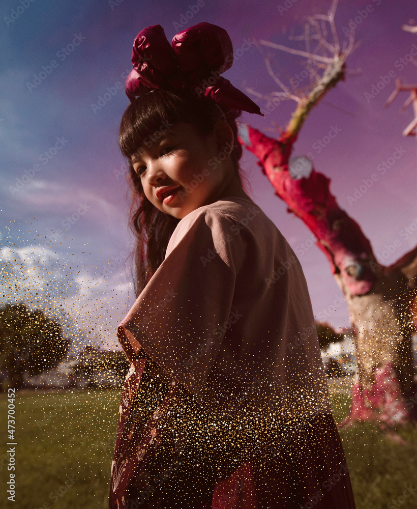 Little girl looking back Stock Photo | Adobe Stock