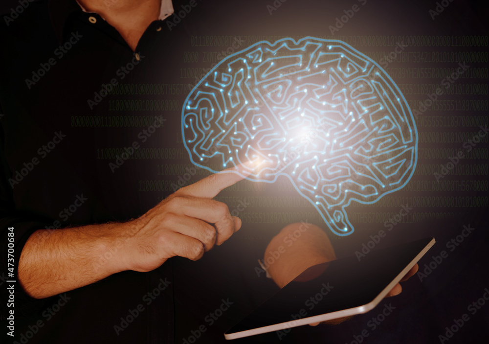Abstract man pointing at digital image of brain on virtual screen above ...