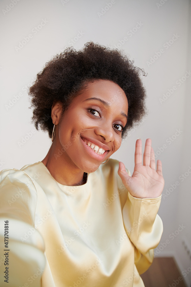Young black woman taking a selfie. Stock Photo | Adobe Stock