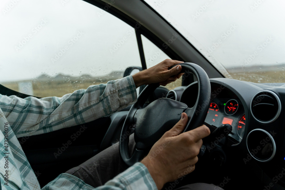 Detail of man hands driving car Stock Photo | Adobe Stock