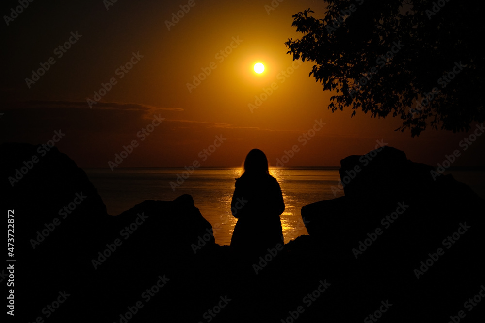 Person Watching Full Moon Over Lake Stock Photo | Adobe Stock