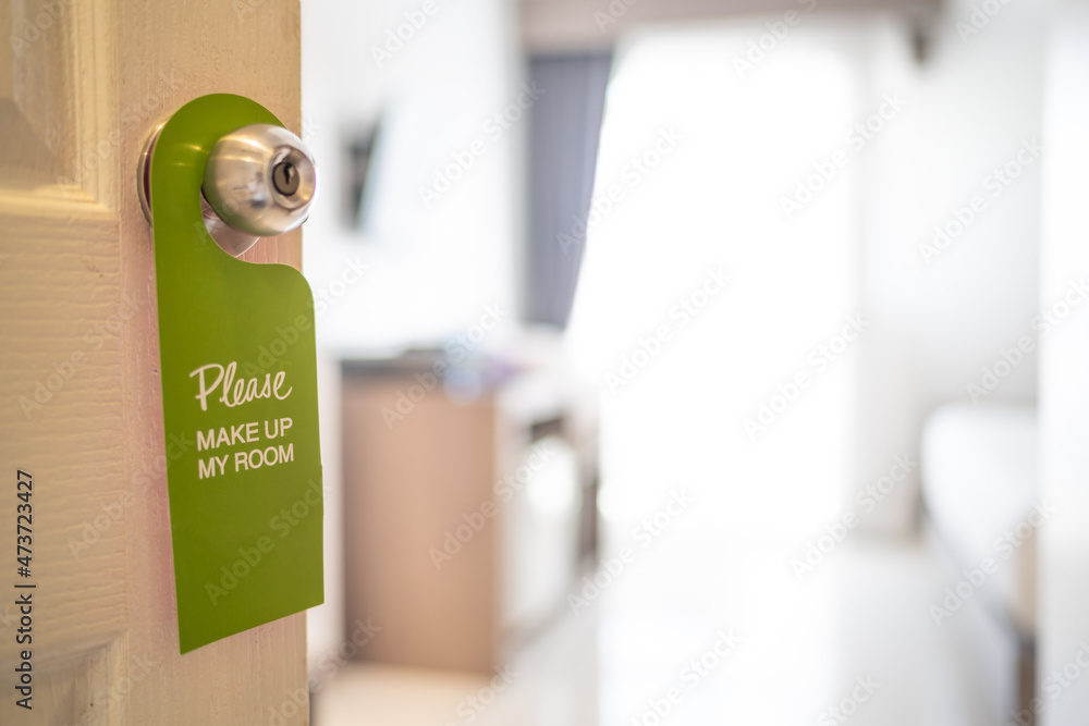 Please make up my room. Maid cleaning the room with please make up my ...