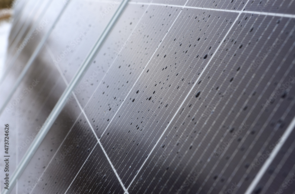 Solar panels Photovoltaic cells with water droplets. Solar panels are ...