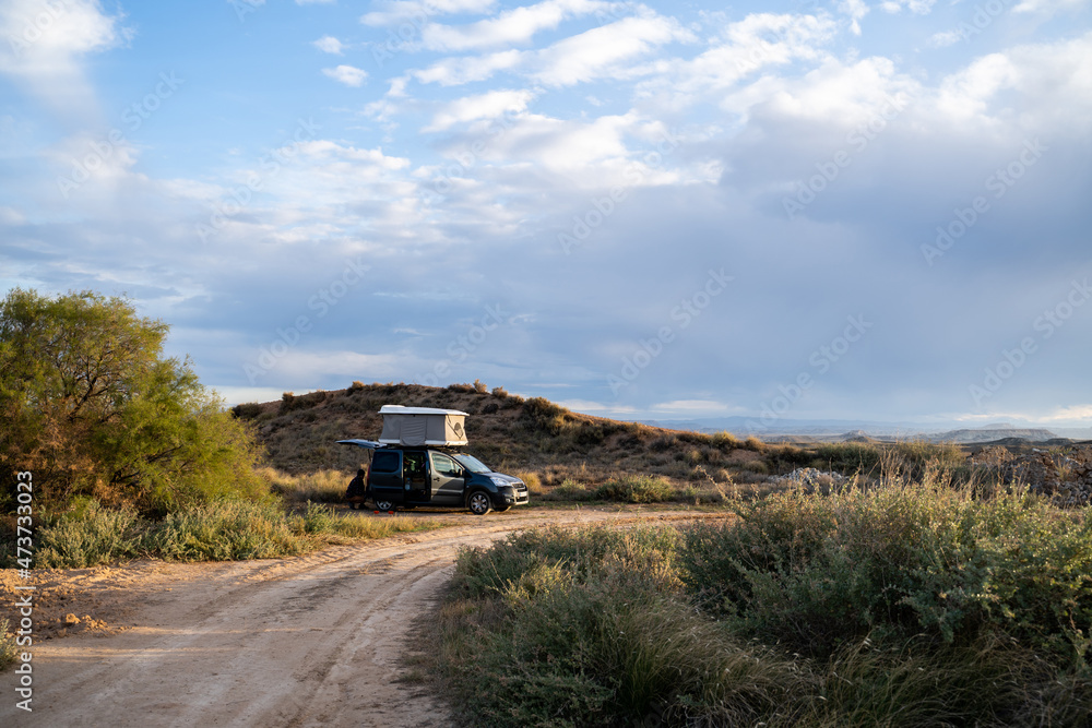 Camper van parked in the middle of desert Stock Photo | Adobe Stock