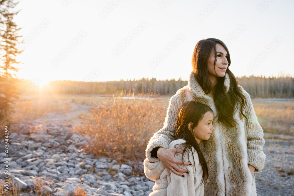 Mother Standing With Daughter Stock Photo | Adobe Stock
