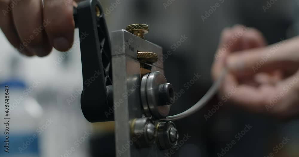 Luthier uses fretbender to set the fret wire radius, preparations for ...