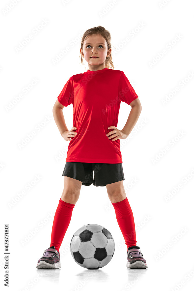 Full-length portrait of girl, child, football player in red uniform ...