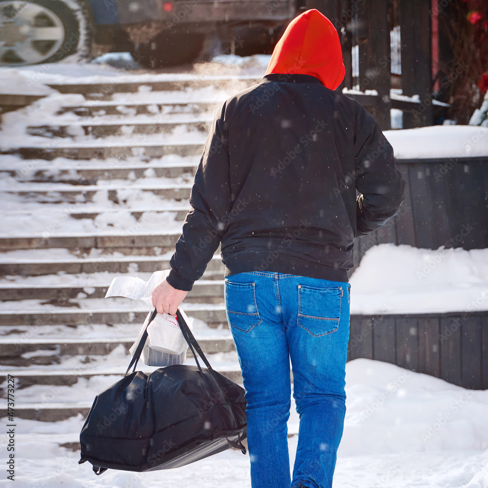 Food delivery service, man deliver pizza during snowfall with thermal ...