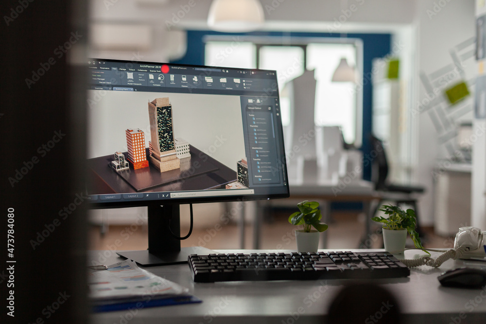 Desktop screen on architect desk showing model of urban planning ...