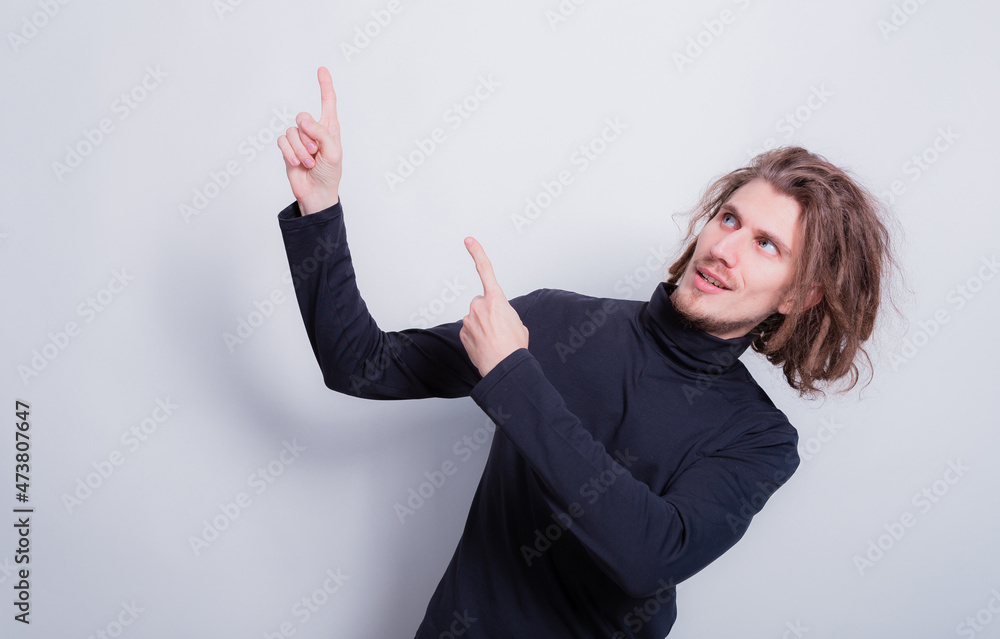 Funny man pointing or show direction. The man points with both hands ...