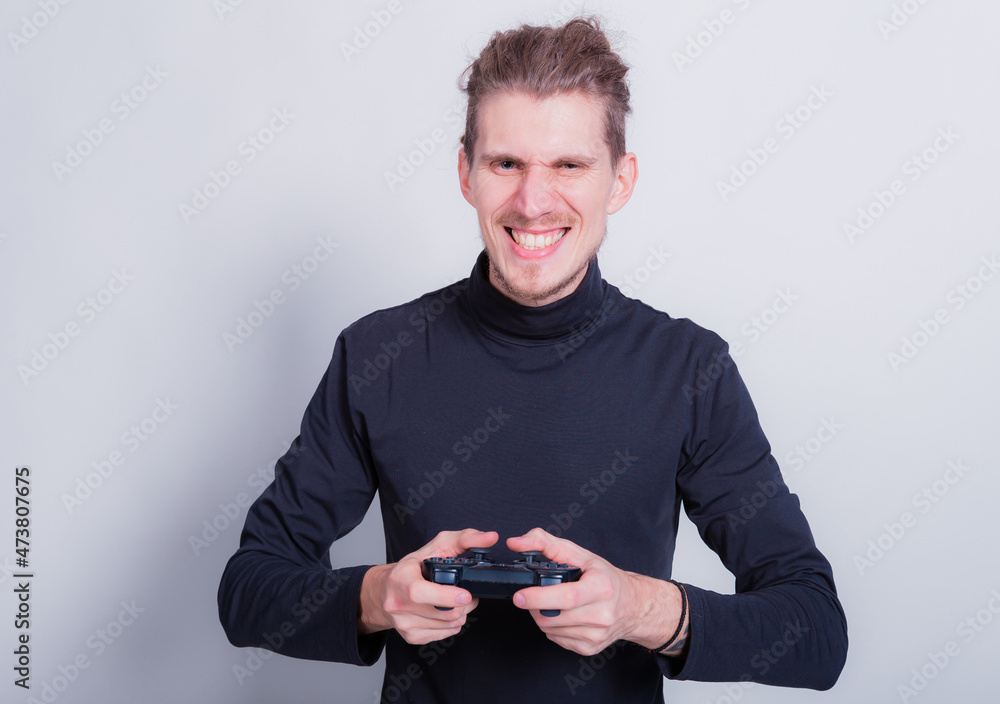 Man holding gamepad controller while playing videogames. Funny ...