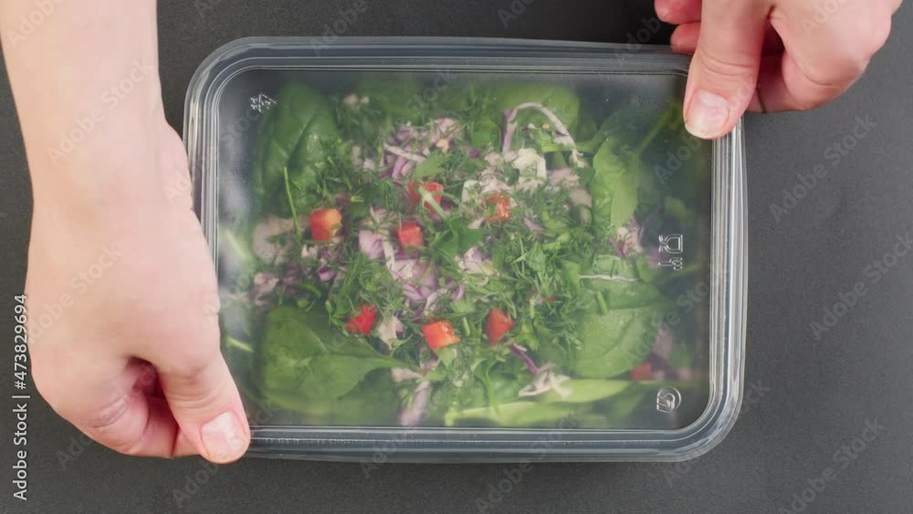 Closing spinach salad close-up. Take away meal top view, Food delivery ...