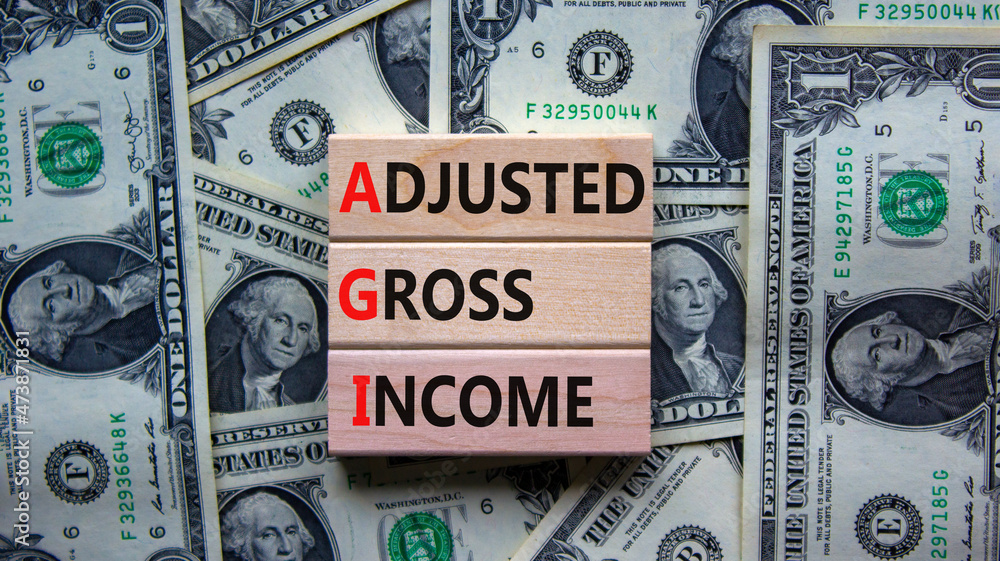 AGI adjusted gross income symbol. Concept words AGI adjusted gross ...