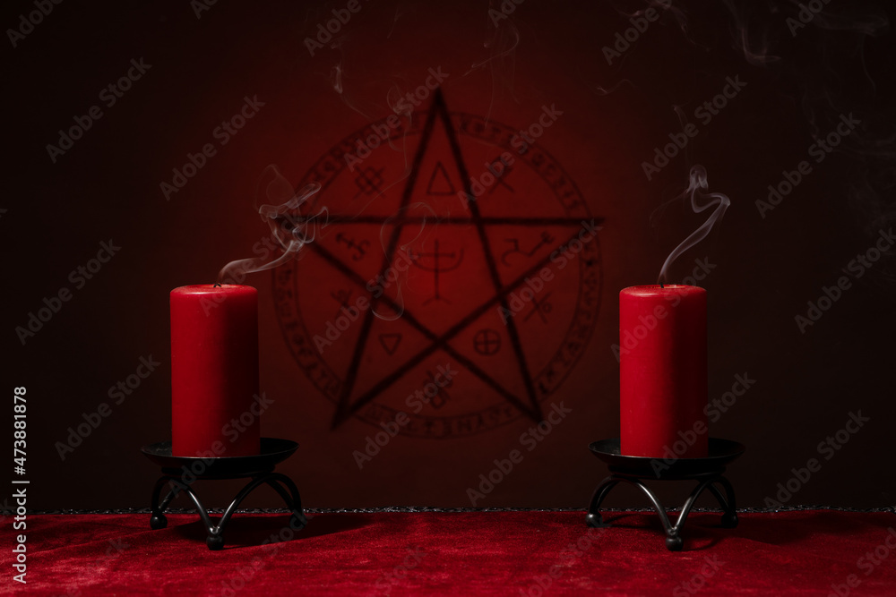 Pentagram symbol and candles. Black magic ritual or spell with occult ...