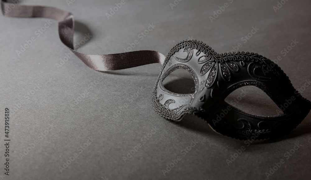 Carnival Venetian black mask on dark grey color background, female ...