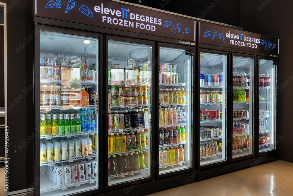 Interior view of a huge fridge with various choices cold beverages in a ...
