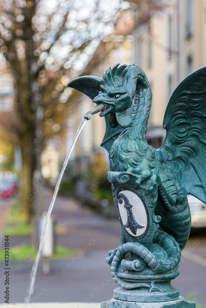 Mythical creature of basilisk on a publich water fountain with Basel ...
