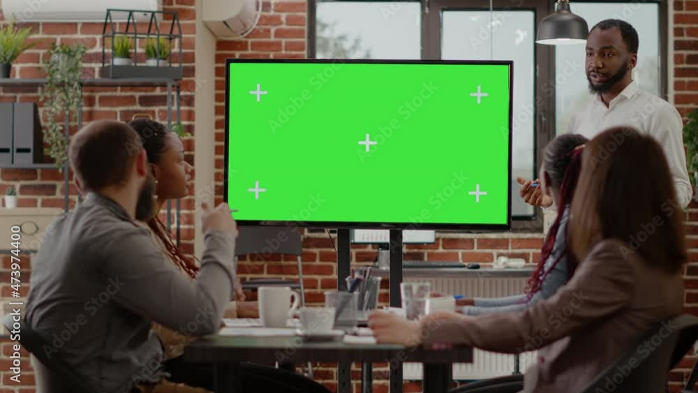People talking and using isolated green screen on display in office ...