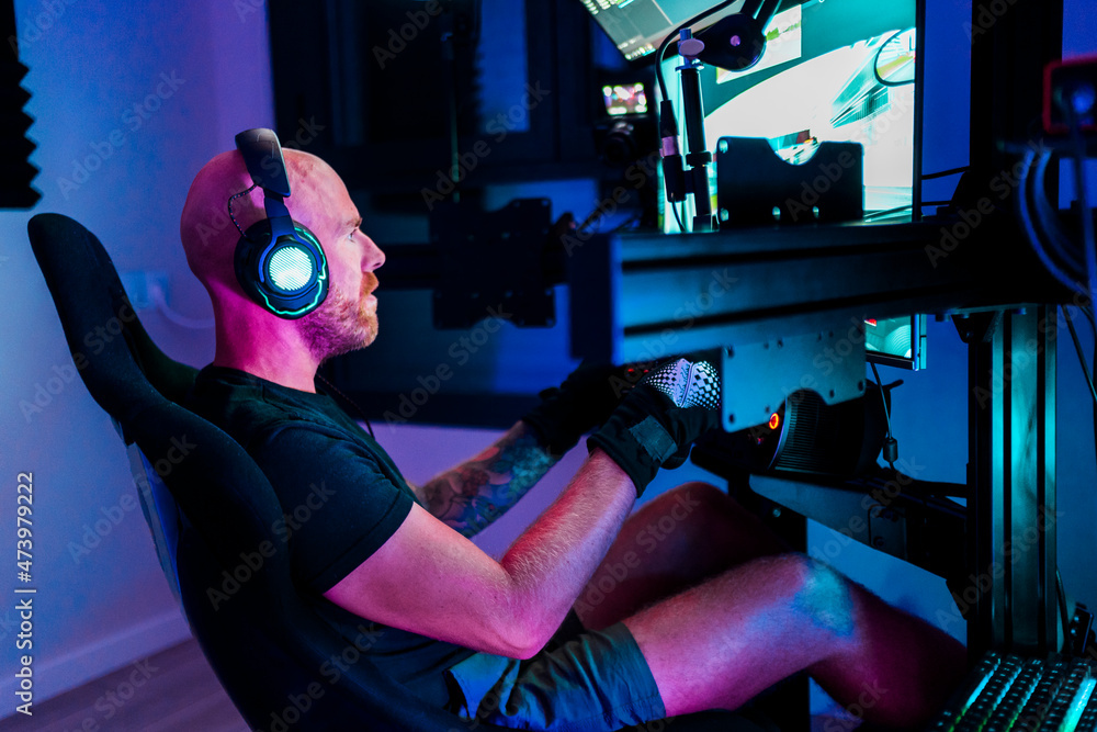 Bald man playing game at studio Stock Photo | Adobe Stock