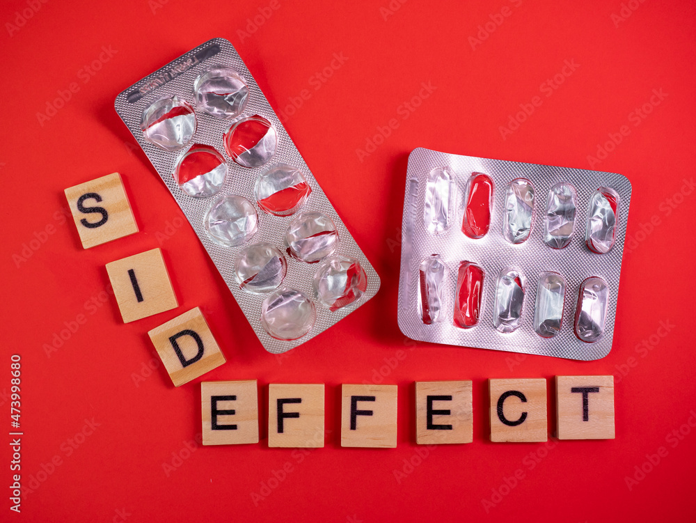 Words side effect on colored red paper texture background. Concept ...
