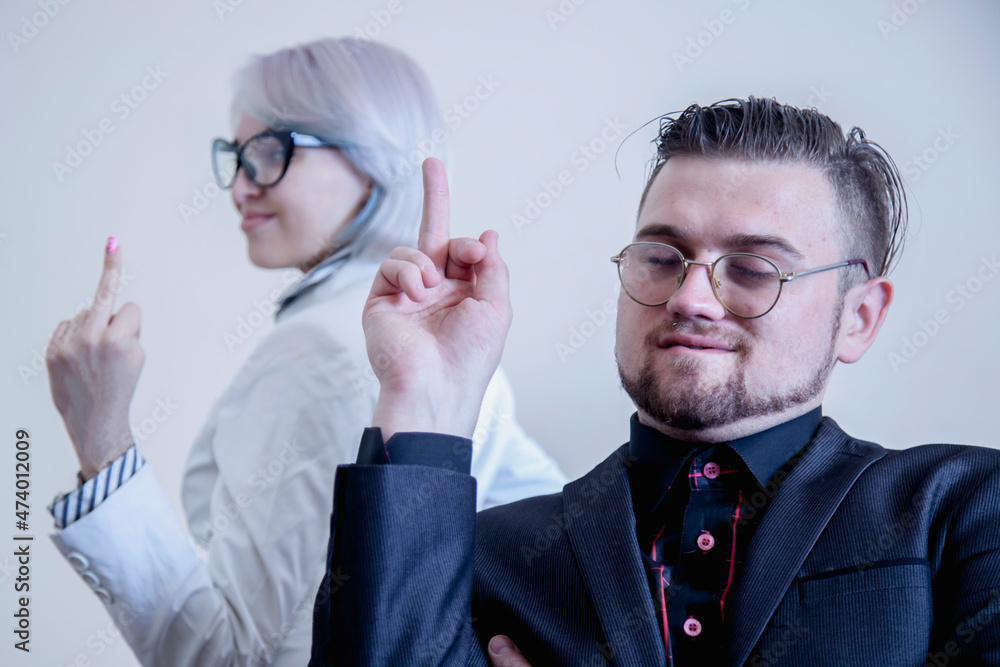 Two employees showing each other a middle finger gesture. Stock Photo ...