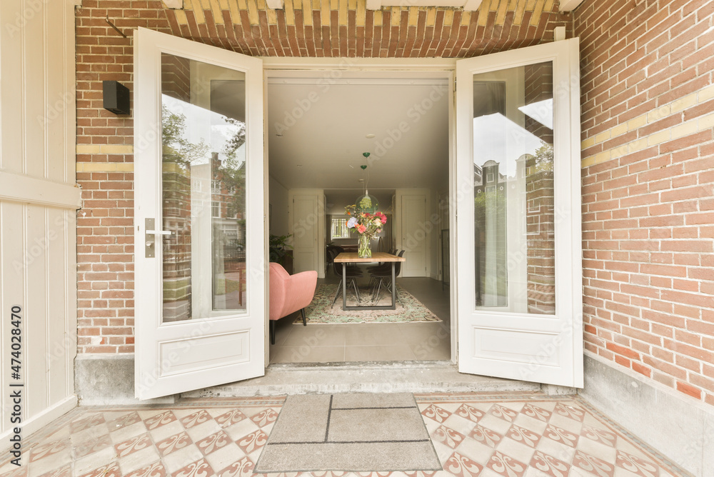 Open doors of house with furniture Stock Photo | Adobe Stock