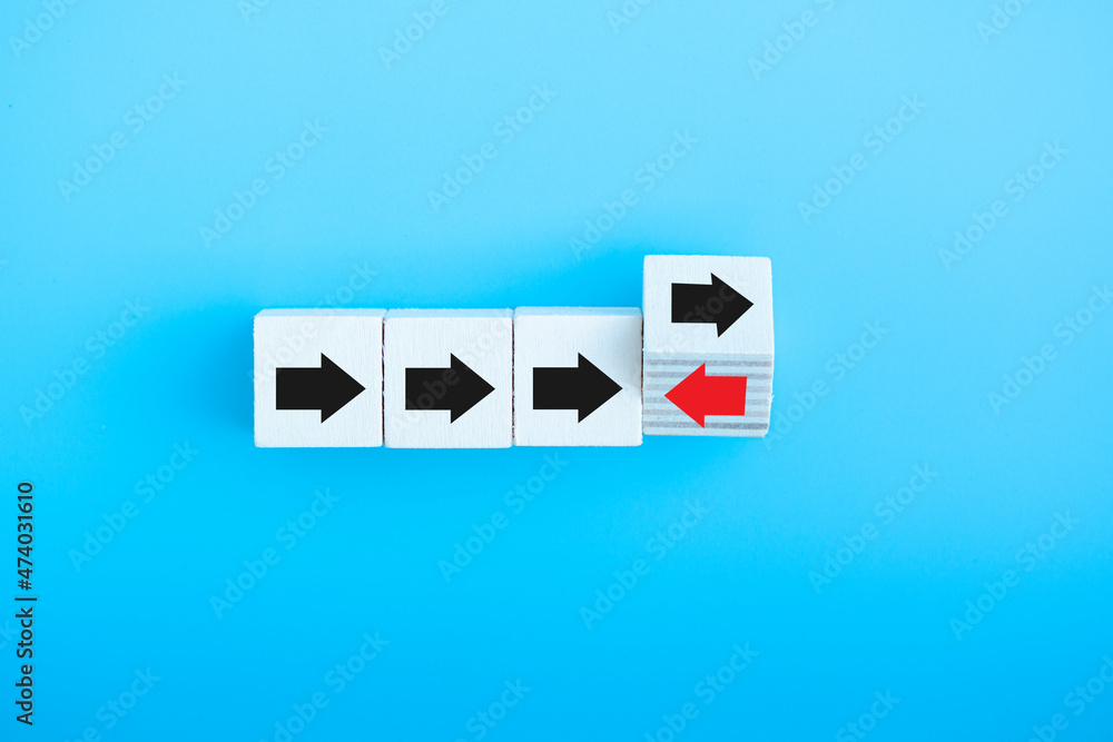 Red arrow flip over wooden cube block with red arrow opposite directon ...