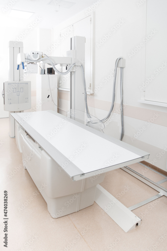 X-ray department in modern hospital. Radiology room with scan machine ...
