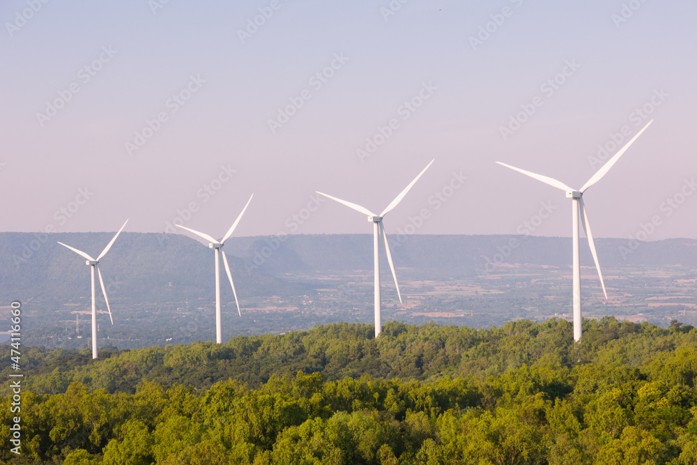 Foto de Many wind turbines in rows located with beautiful landscape on ...